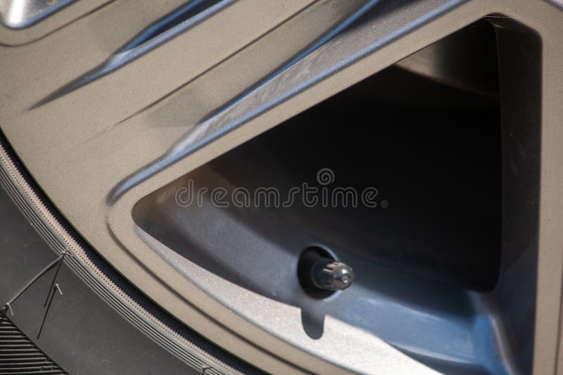 A Valve Stem on a Car Wheel Stock Image - Image of sunny, close: 323823289
