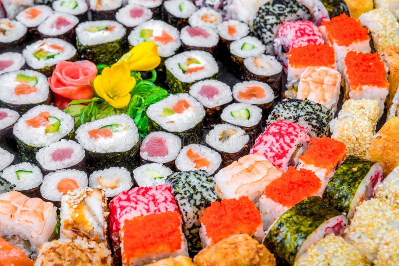 Close Up of a Variety of Sushi Rolls in Different Colors and Flavors ...