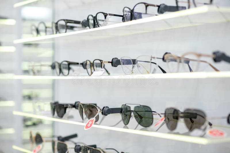 Close Up of Various Glasses Lying on the Shelves in Optical Store Stock ...
