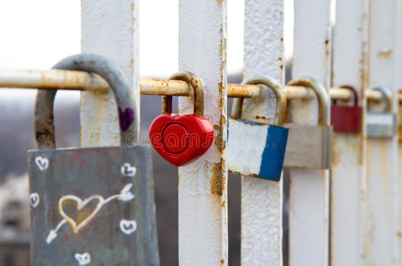Close-up of Various Padlocks, Including a Red Heart-shaped Lock ...