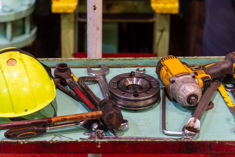 A Close-up of Various Tools Scattered Across a Work Platform in the ...