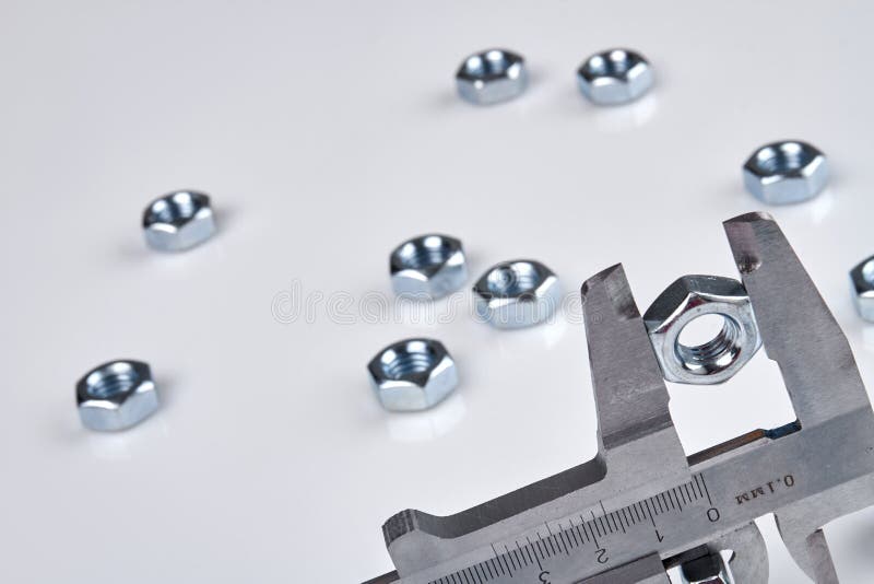 Close-up Vernier Calipers with Clenched Metal Nut. Stock Photo - Image ...