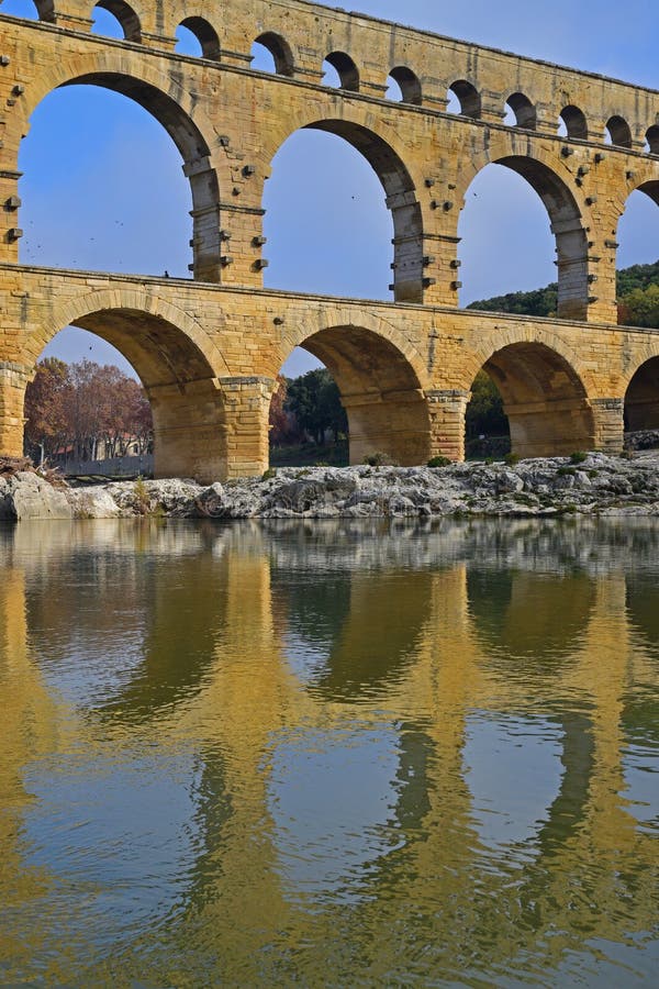 Close Up Vertical Image of Three Arch Level of Pont Du Gard with Clear ...