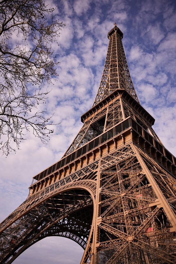 Close-up Vertical View of Eiffel Tower Against Dramatic Cloudy Sky in ...