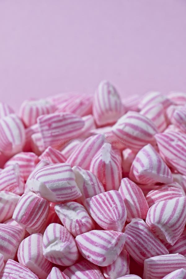 Close Up Vertical View of Pink and White Striped Candy with Copy Space ...