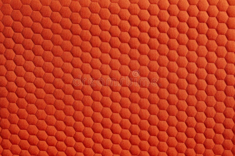 Close Up of a Vibrant Orange Fabric Featuring a Textured Honeycomb ...