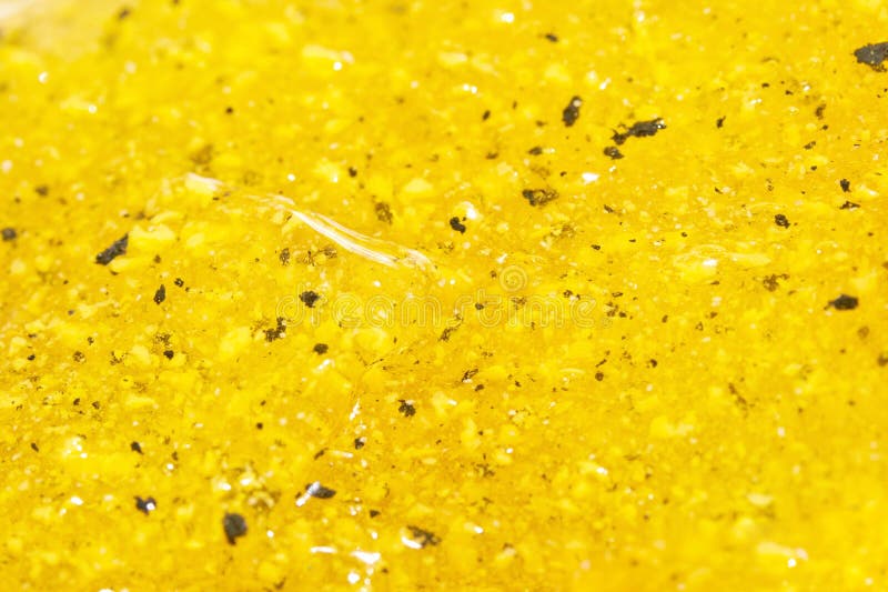 Close Up of Vibrant Yellow Slime with Textured Grains and Shimmering ...