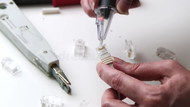 Hand Testing and Assembling Ethernet Connector with Network Cable in a ...