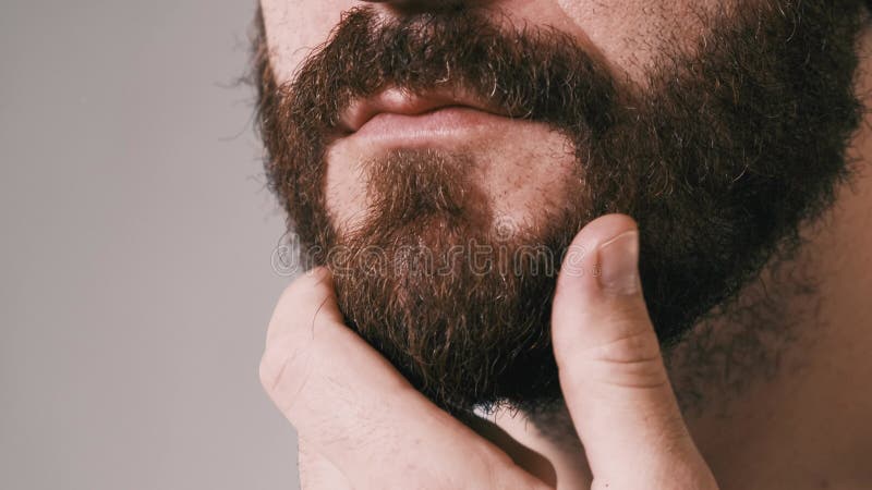 Close Up Video of Man Touching His Beard and Thinking Stock Video ...