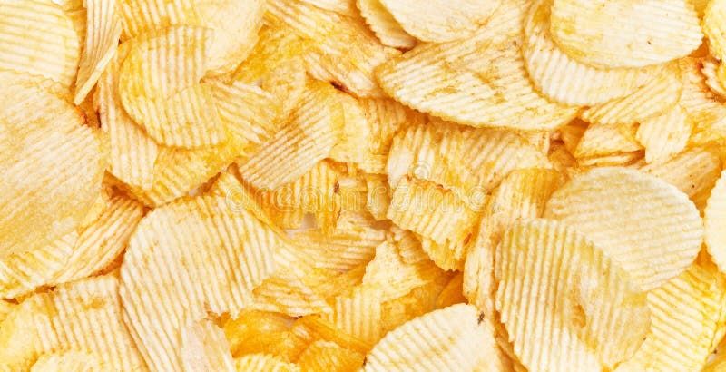 Close-up View of Abundant Crispy Potato Chips Filling the Frame for a ...