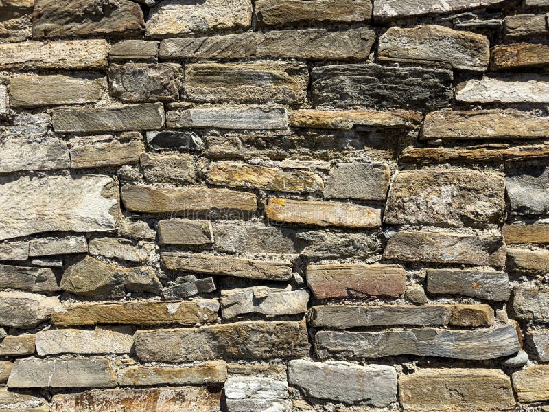Old Stone Masonry Wall with Rough Textured Rocks Close-up Stock Image ...
