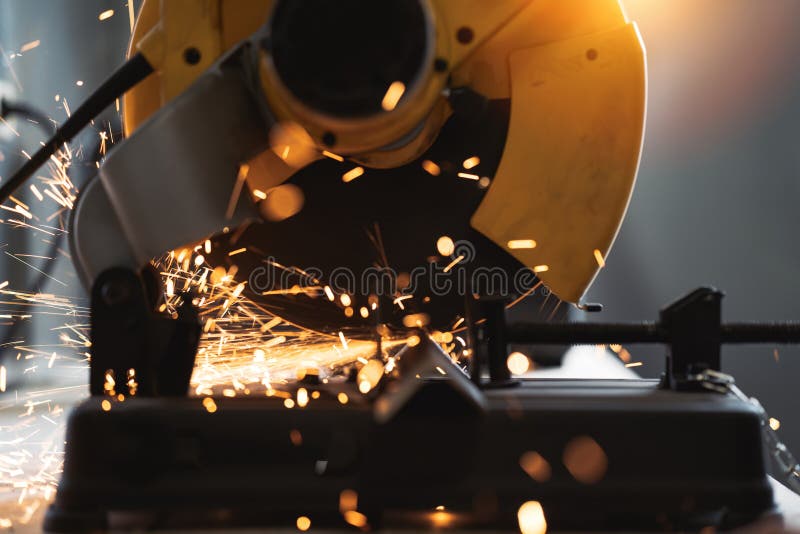 Close-up View of Angular Grinding Machine in Action, Sparks Fly Apart ...