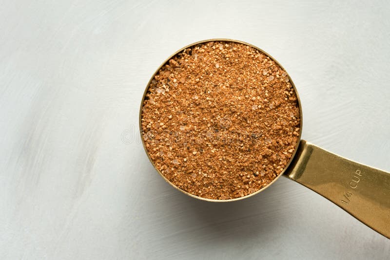 BBQ Rub in a Gold Measuring Cup Stock Image - Image of close ...