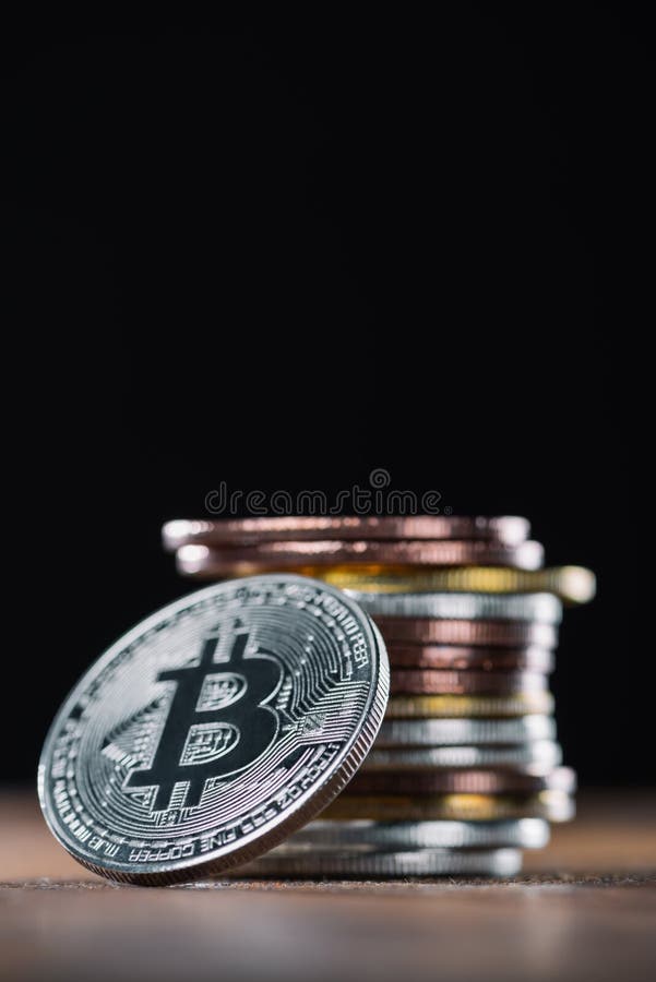 Close Up View of Bitcoin Leaning on Stack of Various Bitcoins Stock ...