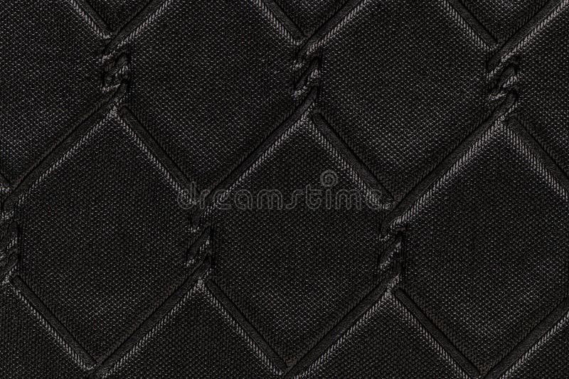A Close-up View of a Black Fabric with a Raised, Diamond-shaped ...