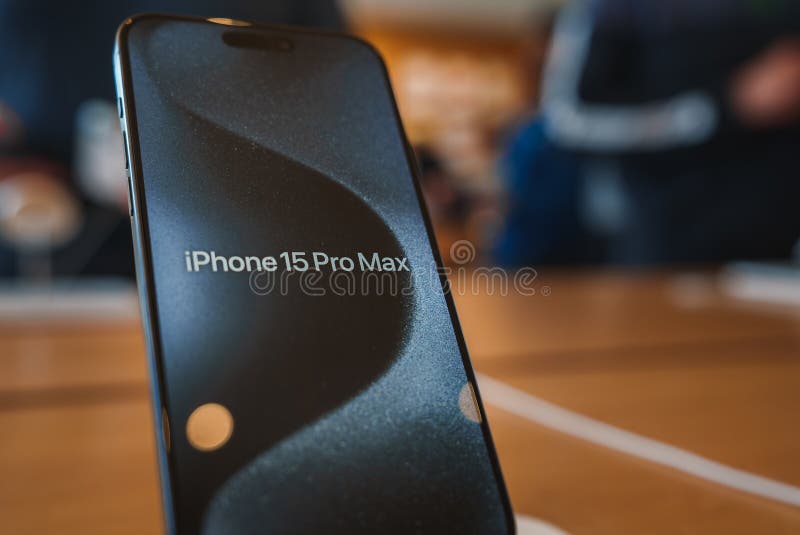 Close Up View Black IPhone 15 Pro Max, Store Interior Background, Warm ...