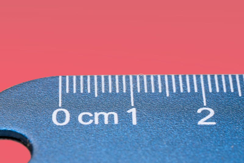 Close Up View of Blue Centimeter Ruler on Pink Background Stock Photo ...