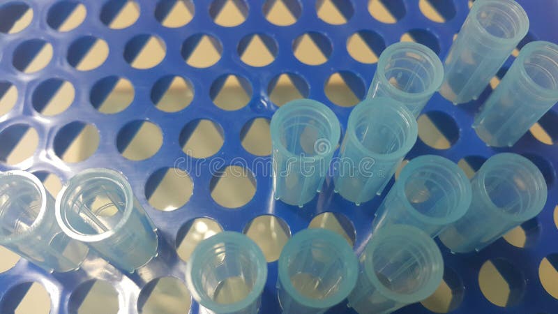 Close Up View of Blue Micro Litre Tips in Microtip Box with Empty Holes ...