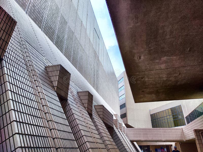 A Close-up View of a Brick-patterned Building Facade with an ...
