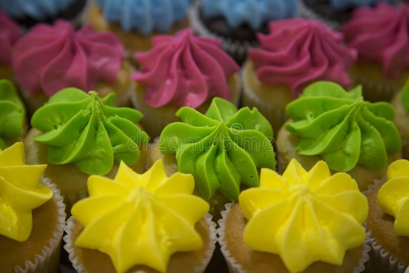 Close Up View of Brightly Colored Cupcakes Stock Photo - Image of pink ...