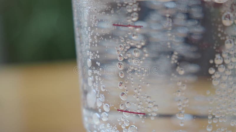 Bubbles Forming in a Clear Container Filled with Sparkling Water Stock ...