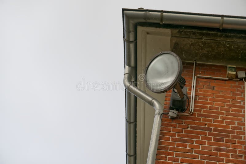 Building Corner with Light Fixture and Drainage Pipe Stock Photo ...