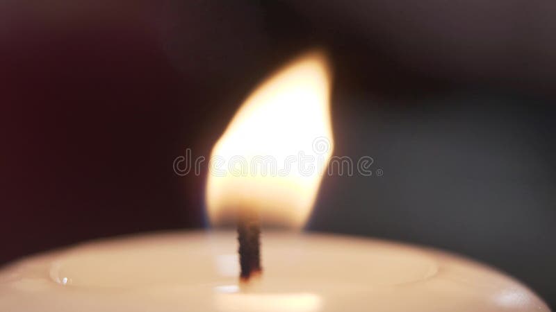 Close-up View of a Burning Candle. the Flame Waving on the Wind, Macro ...