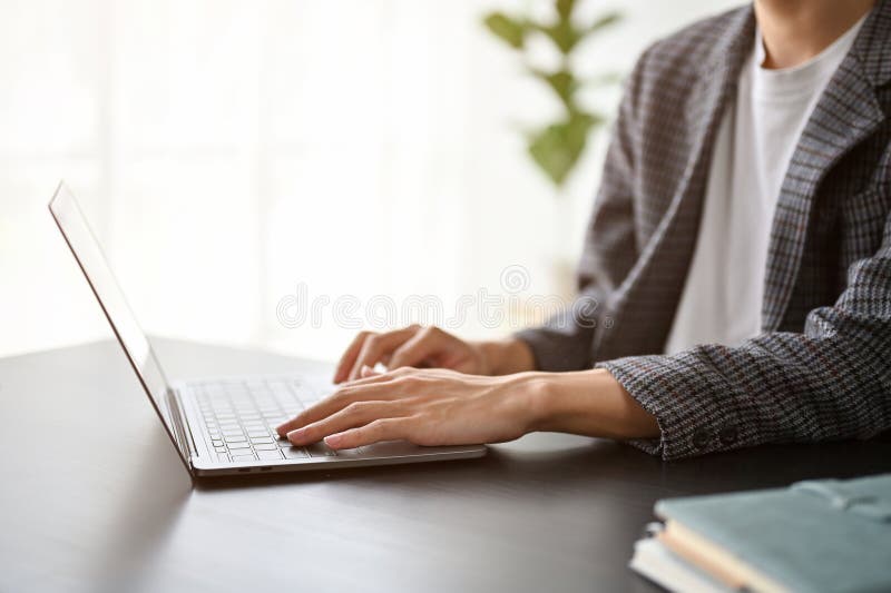 Close Up View of Businessman Typing on Laptop while Working in the ...