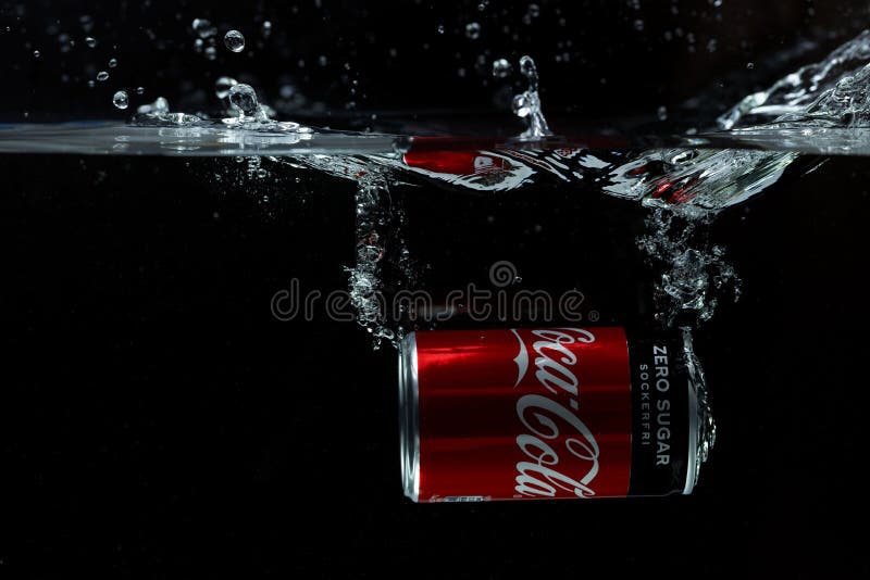 Close Up View Of Coca And Pepsi Falling In Water On Black Background ...