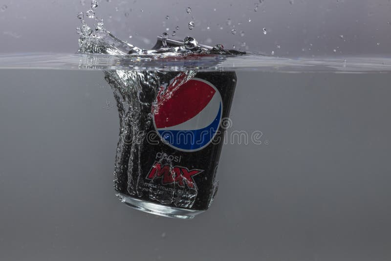 Close Up View of Can of Pepsi Cola Falling into Water Isolation on ...