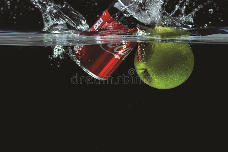 Close Up View of Can of Pear Sider Falling into Water Isolation on ...