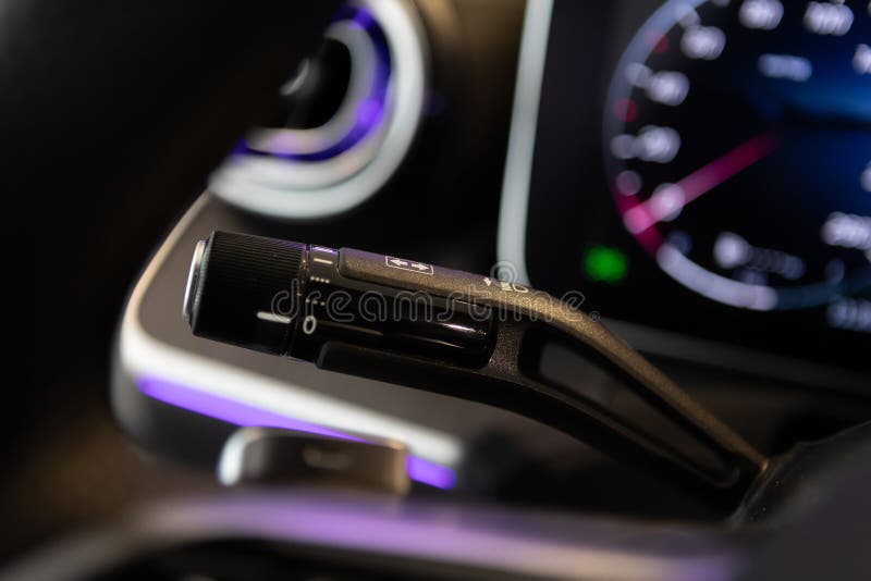 Close-up View of a Car Indicator Control Lever with a Blurred Dashboard ...