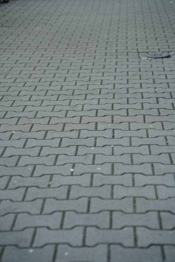 A Close-up View of Concrete Pavement Surface, Showcasing Interlocking ...