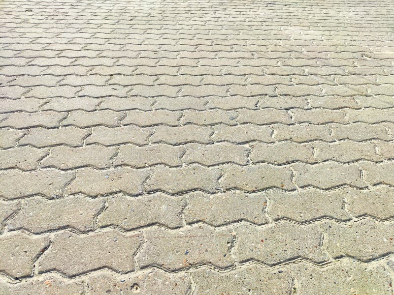 A Close-up View of a Concrete Pavement Surface, Showcasing Interlocking ...