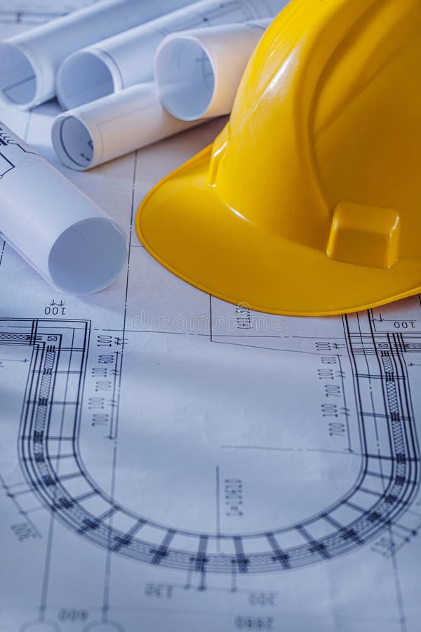 Close Up View Construction Helmet and Rolled Blueprints Stock Photo ...