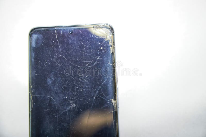 Close-Up View of a Cracked Smartphone Screen Against White Background ...