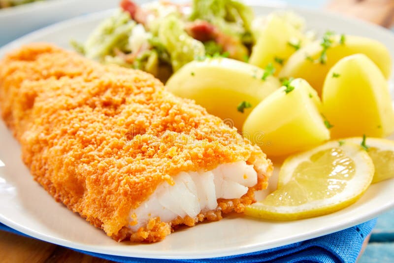 Crispy Breaded Fish with Potatoes in Close Up Stock Photo - Image of ...
