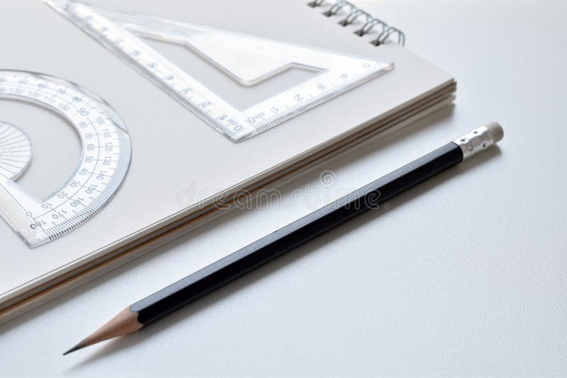 Close-up View, the Desk Has a Black Pencil, Ruler and White Book. Stock ...