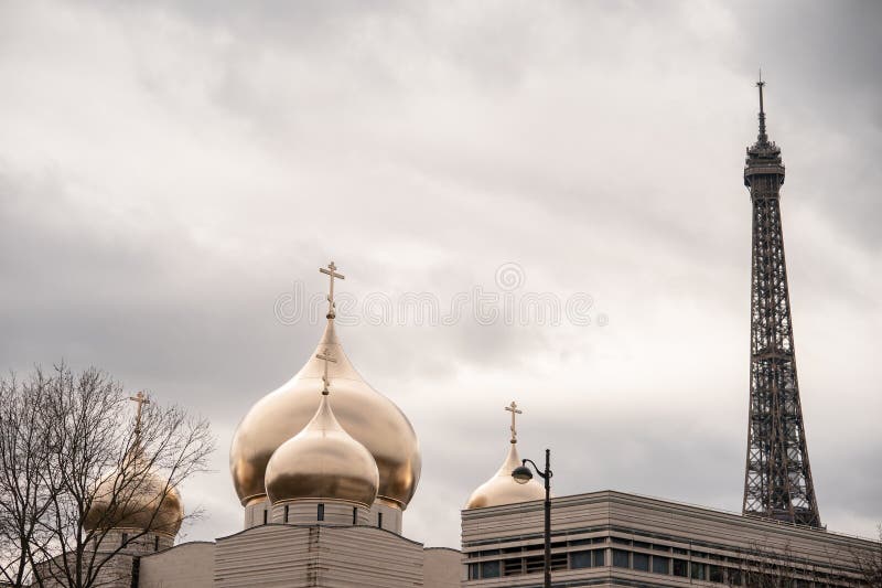 Close Up View of the Eiffel Tower Head with Golden Dome Mosque Stock ...
