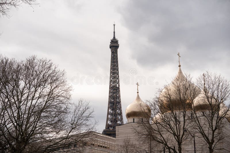 Close Up View of the Eiffel Tower Head with Golden Dome Mosque Stock ...