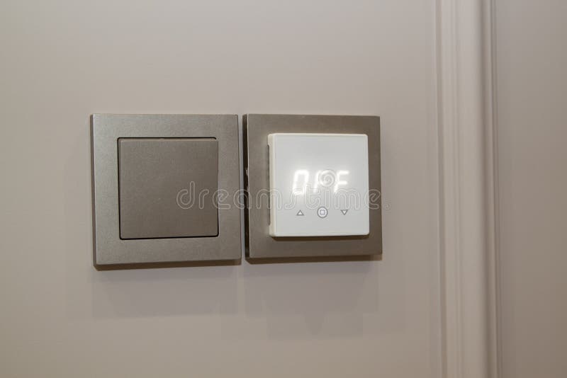 Close Up View of Electric Light Switch and Sensor for Floor Heating on ...
