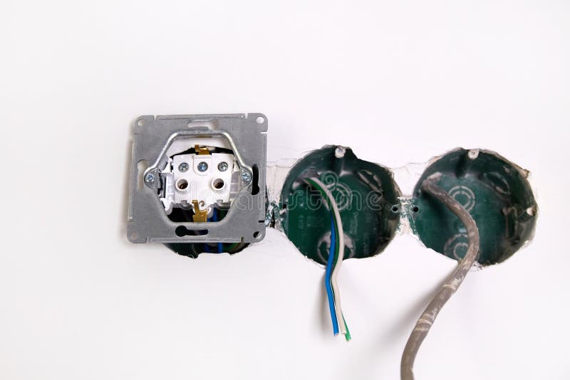 A Close-up View of an Electrical Outlet Being Installed into a Wall ...