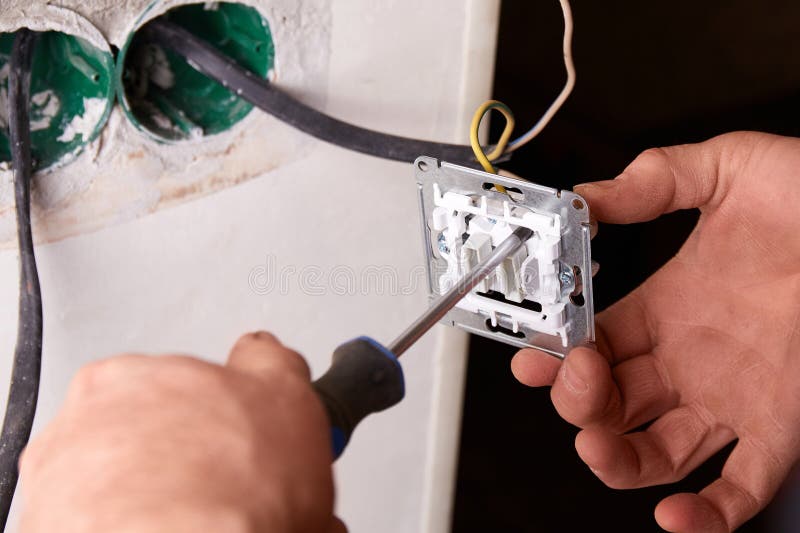 A Close-up View of an Electrical Outlet Being Installed into a Wall ...