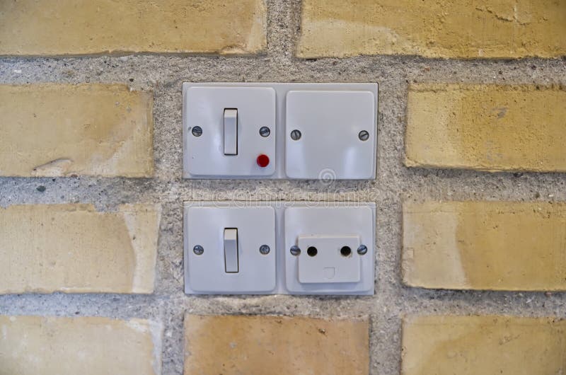 Electrical Switches and Socket on Brick Wall Stock Image - Image of ...