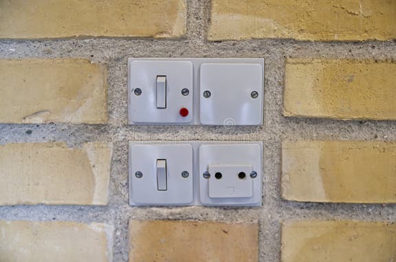 Electrical Switches and Socket on Brick Wall Stock Image - Image of ...