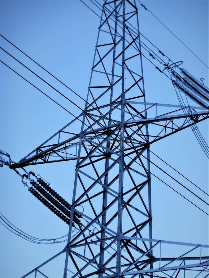 Close Up Electricity Pylon Against Blue Sky Stock Photo - Image of ...