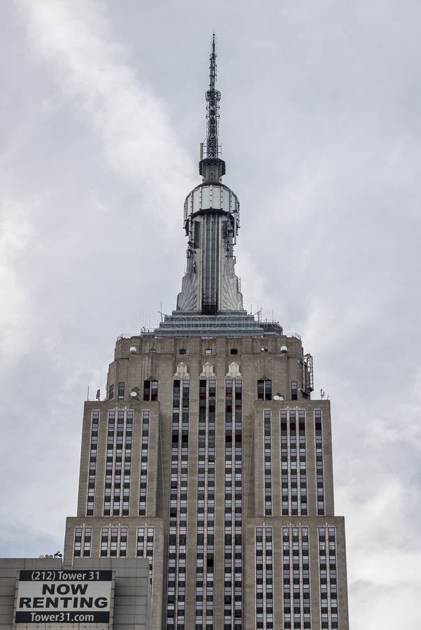 Close-up View of the Empire State Building on a Cloudy Sky Background ...