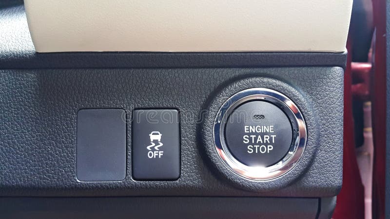 Close Up of Engine Start Stop Button and Traction Control Button of the ...
