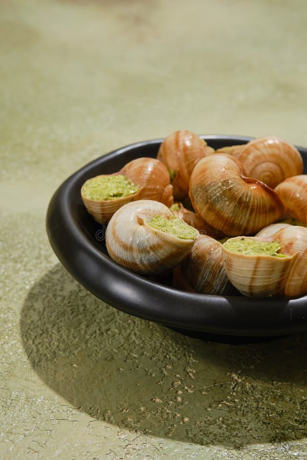 Close-up View of Escargot Snails Stuffed with Butter, Spice and ...