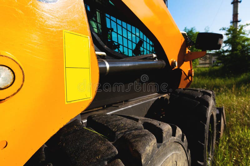 Close-up View of an Excavator from Behind with Sun Glare. Tail Lights ...